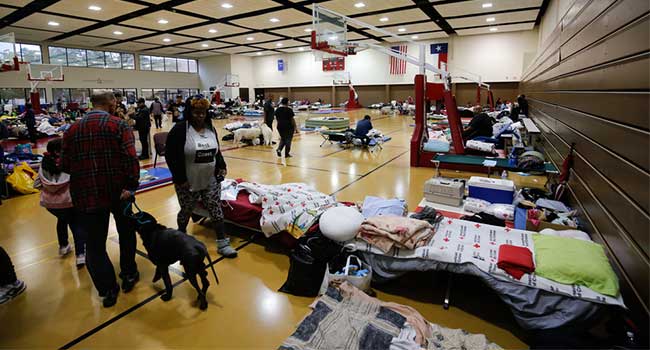 School-Turned-Shelter Following Hurricanes Patrolled by National Guard ...